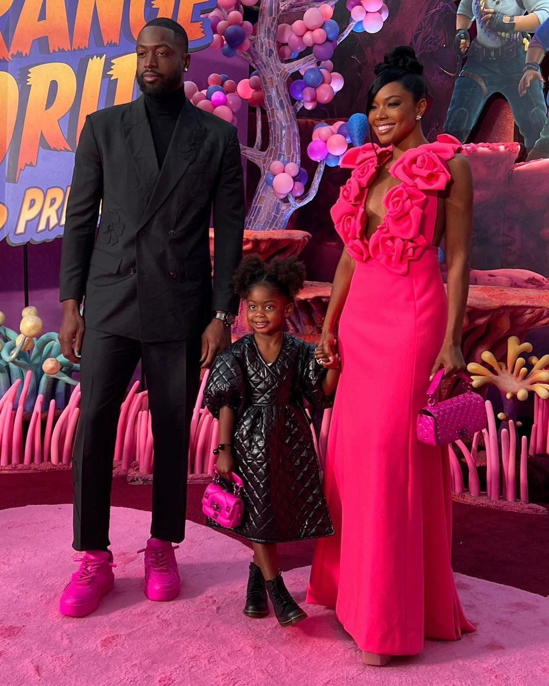 Dwyane Wade and his wife stand out in chic pink outfits at the ‘Strange ...